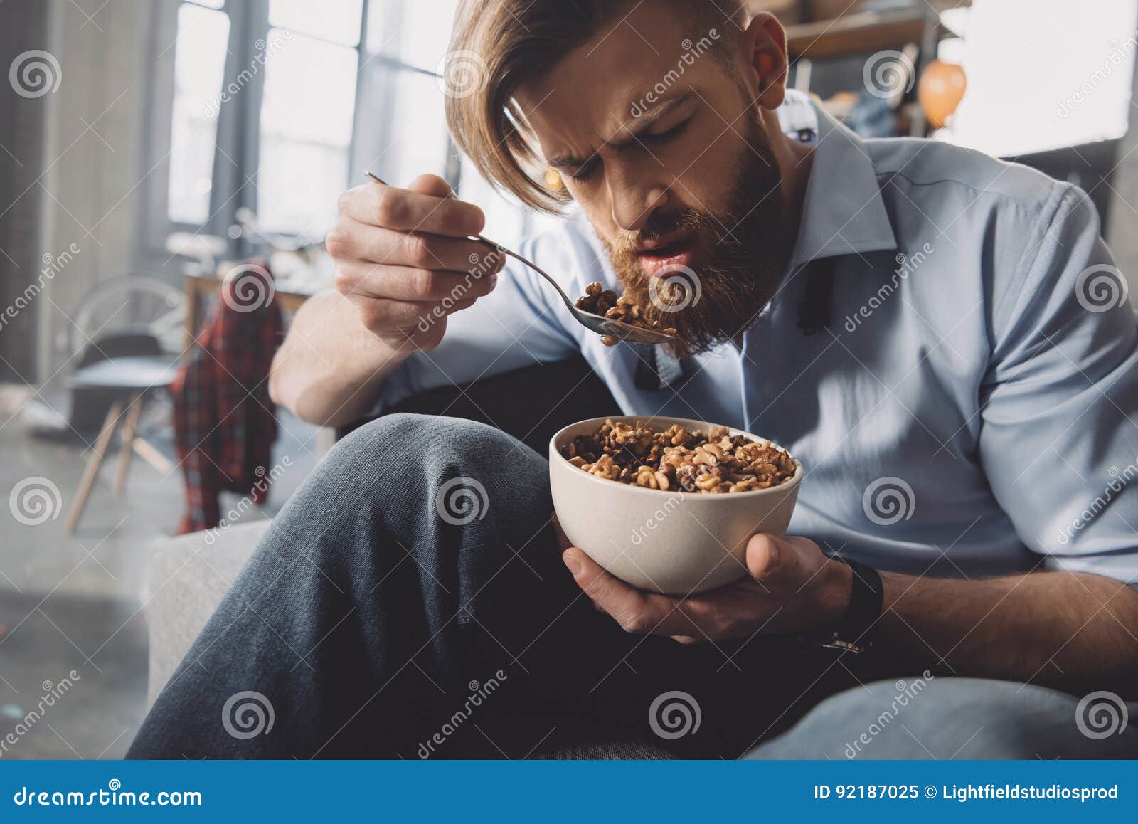 Man Eating Corn Flakes in Messy Room Stock Image - Image of chaos, food ...