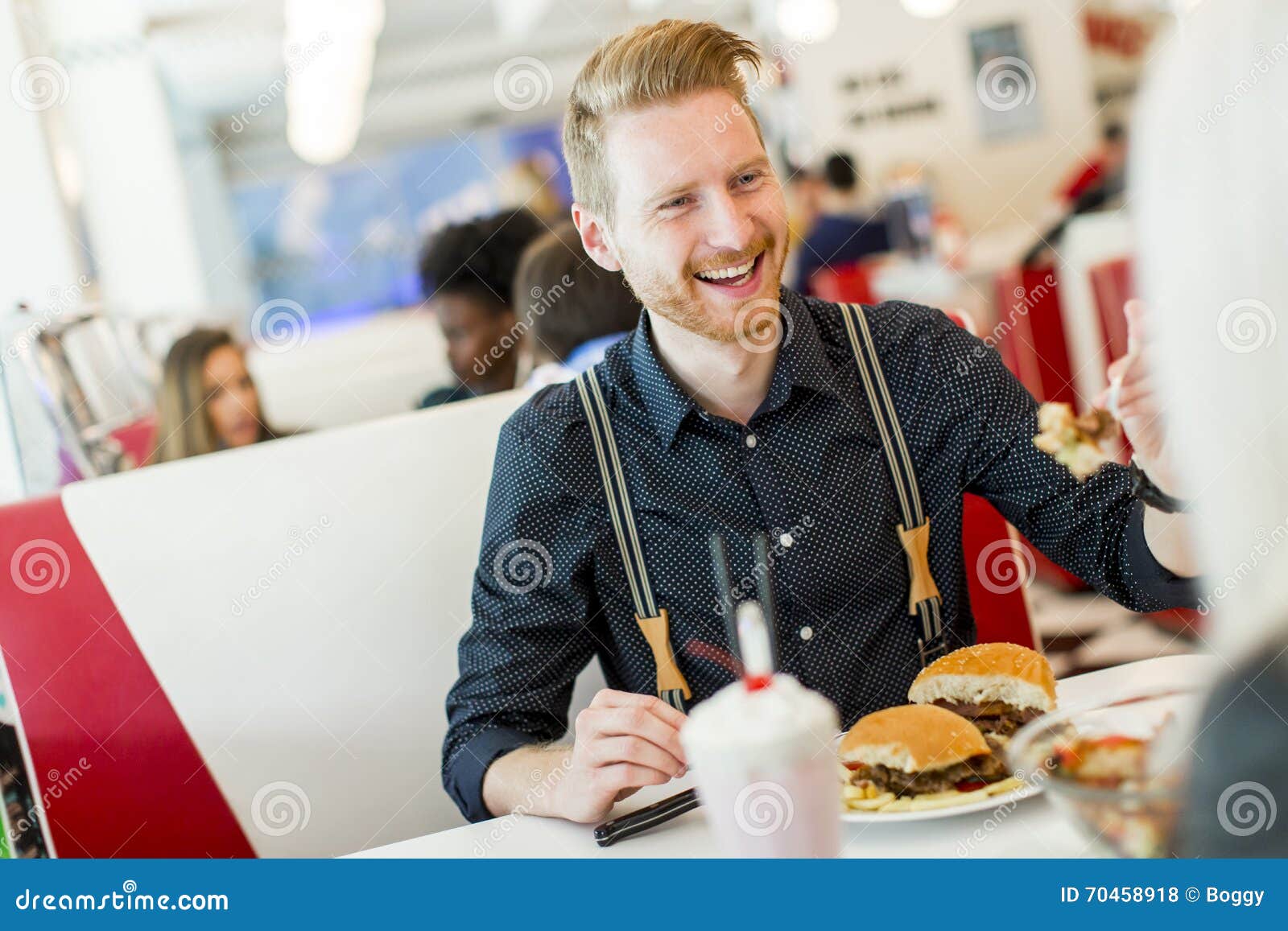 Man eating in the diner stock photo. Image of unhealthy - 70458918