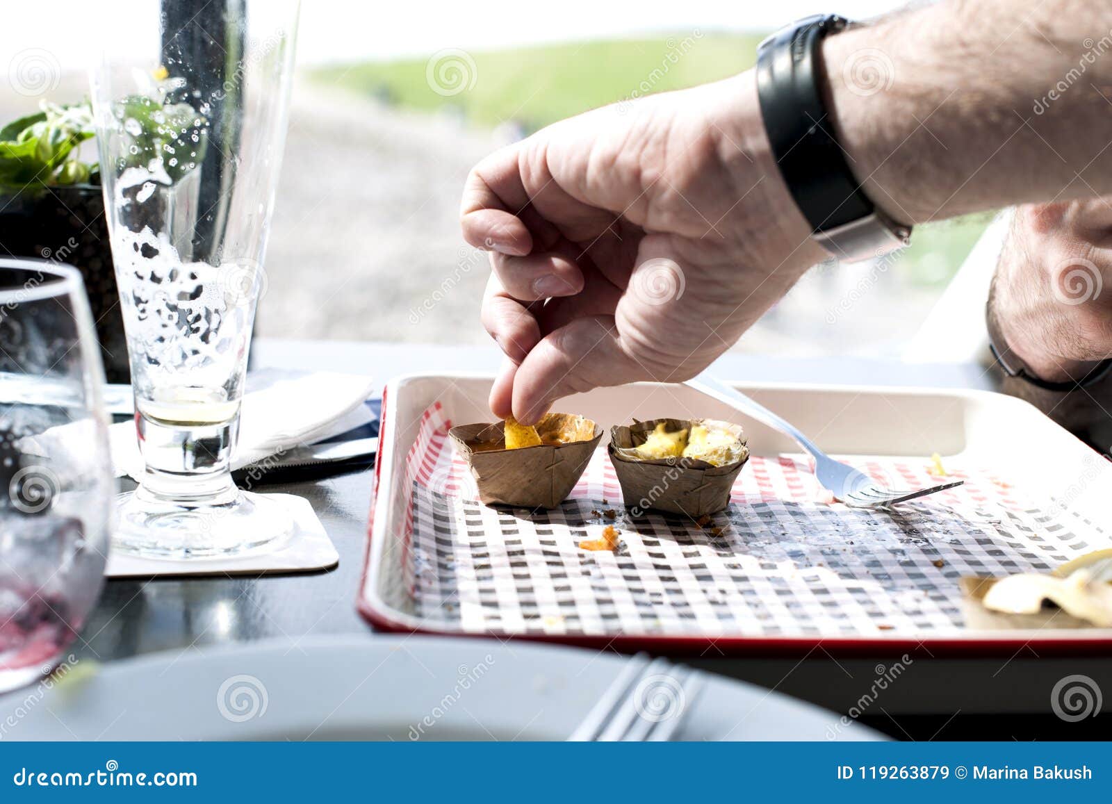 The Man is Eating Fast Food in a Cafe. a Table by the Window. Empty ...