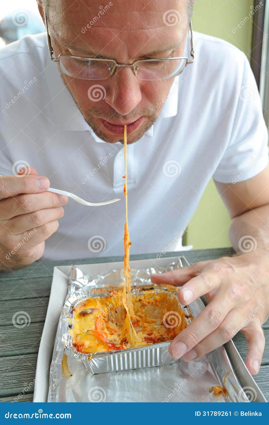 Man eating fast food stock image. Image of hungry, glass - 31789261