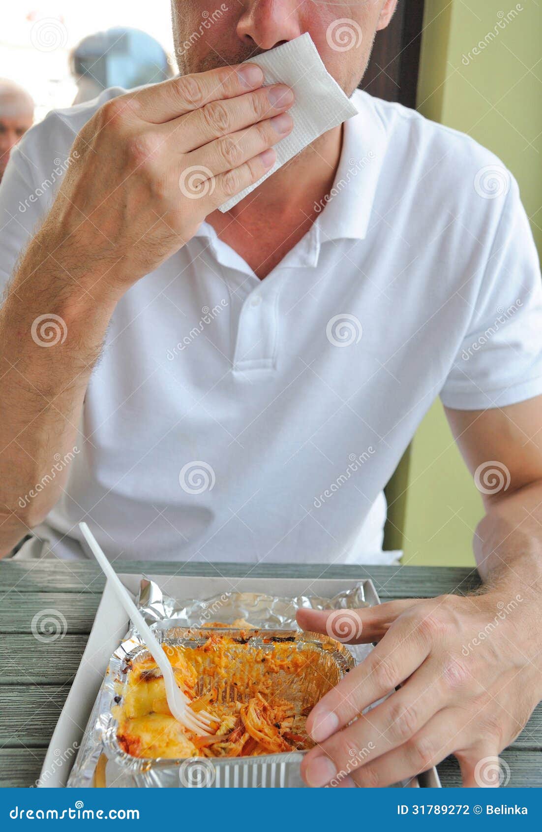 Man eating fast food stock photo. Image of community - 31789272