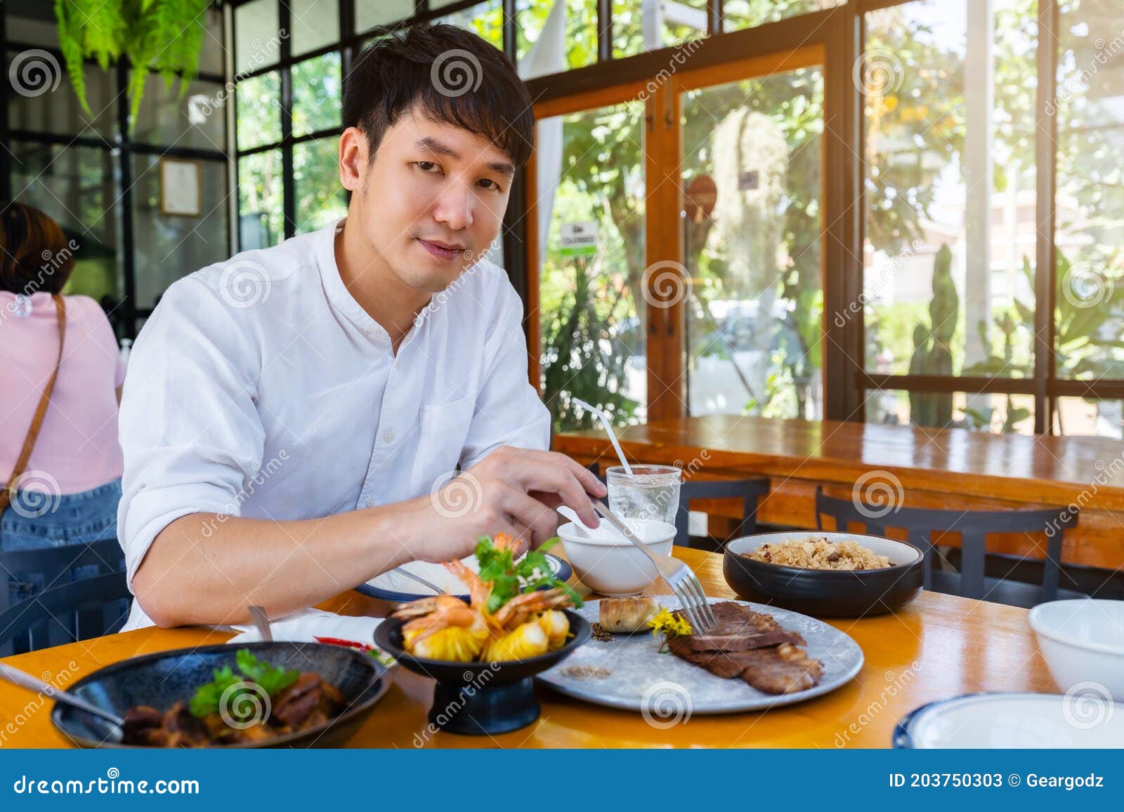 Man Eating Food in Restaurant Stock Image - Image of drink, portrait ...
