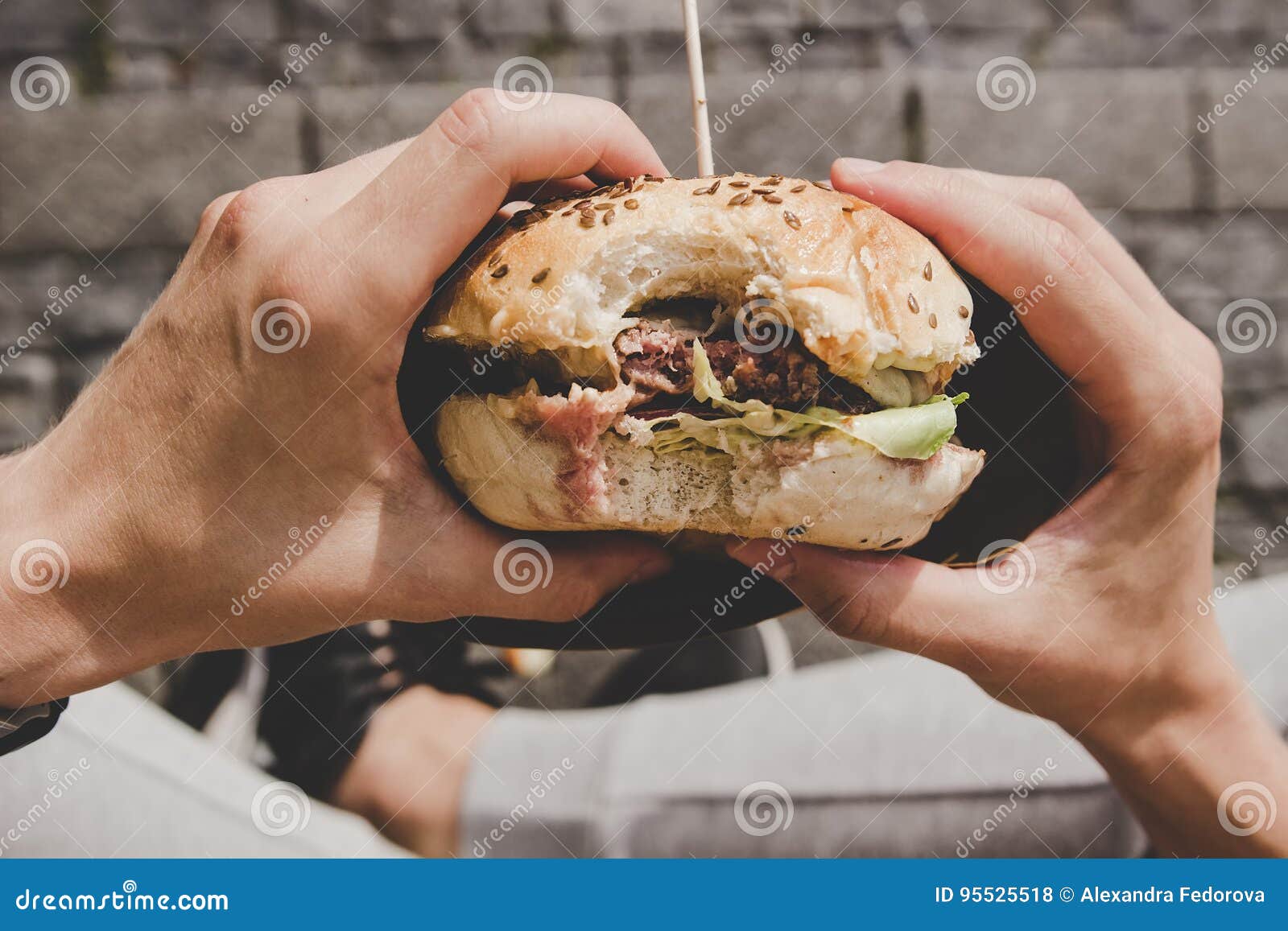 Man Eating Fresh Tasty Grilled Burger. Top View Stock Photo - Image of ...