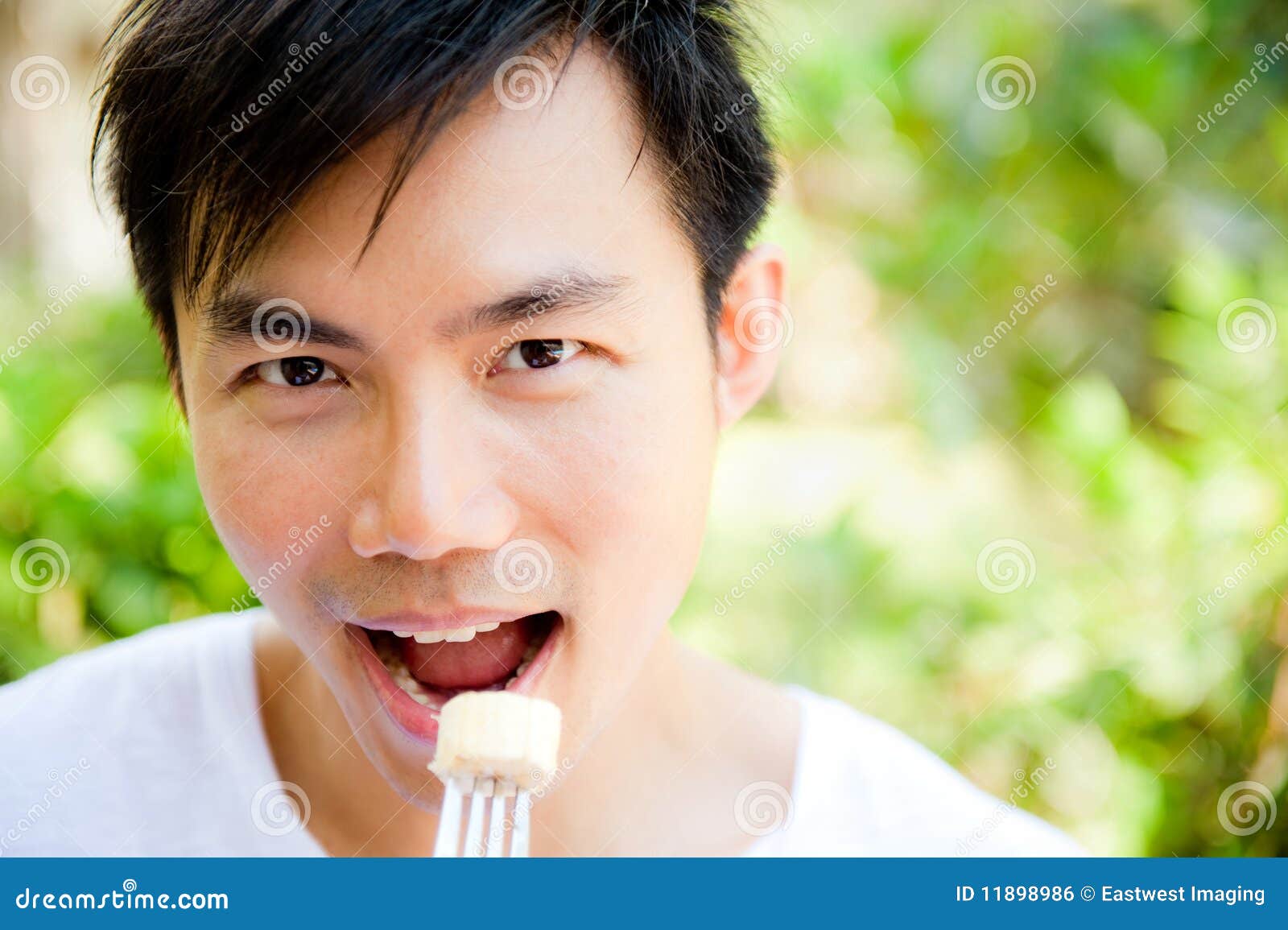 Man Eating Fruit stock photo. Image of young, outside - 11898986