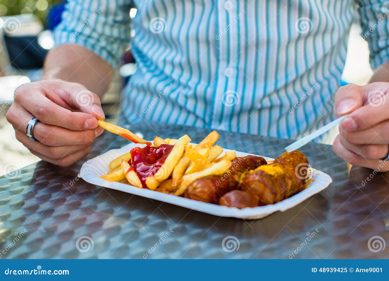 Man Eating German Currywurst Stock Image - Image of young, currywurst ...