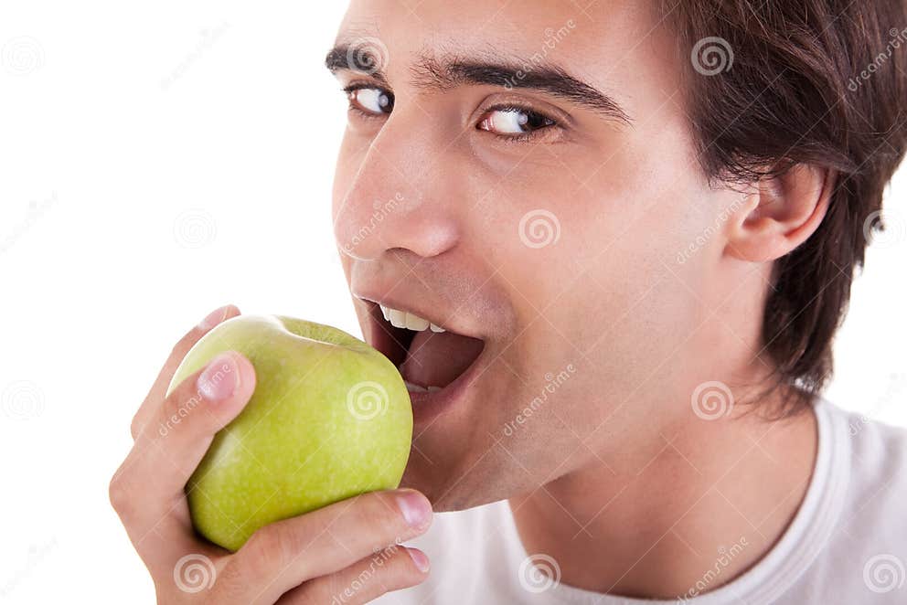 Man eating a green apple stock photo. Image of background - 14311500