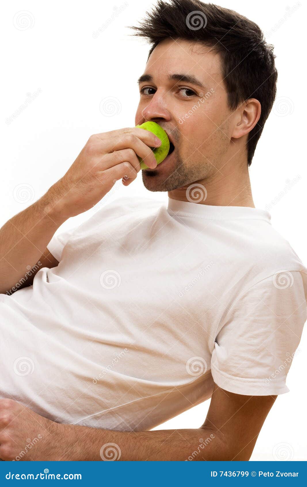 Man eating green apple stock image. Image of fruit, isolation - 7436799