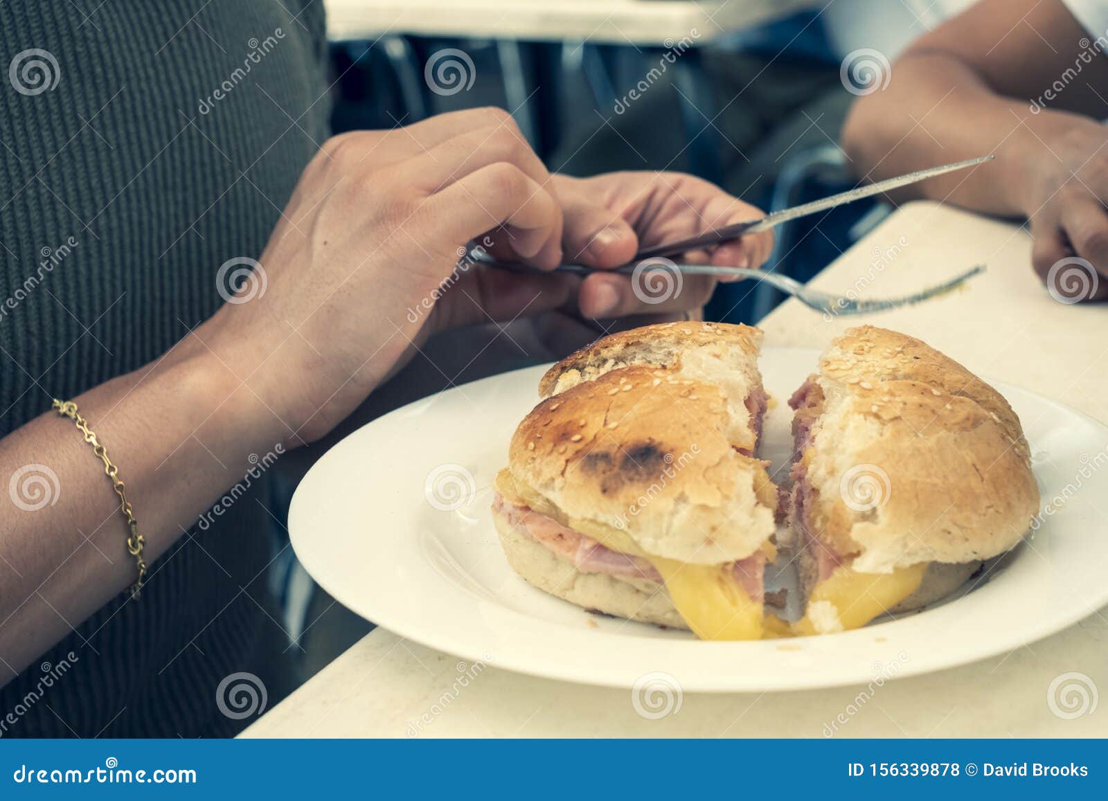 Man Eating Ham and Cheese Sandwich Stock Photo - Image of sitting ...