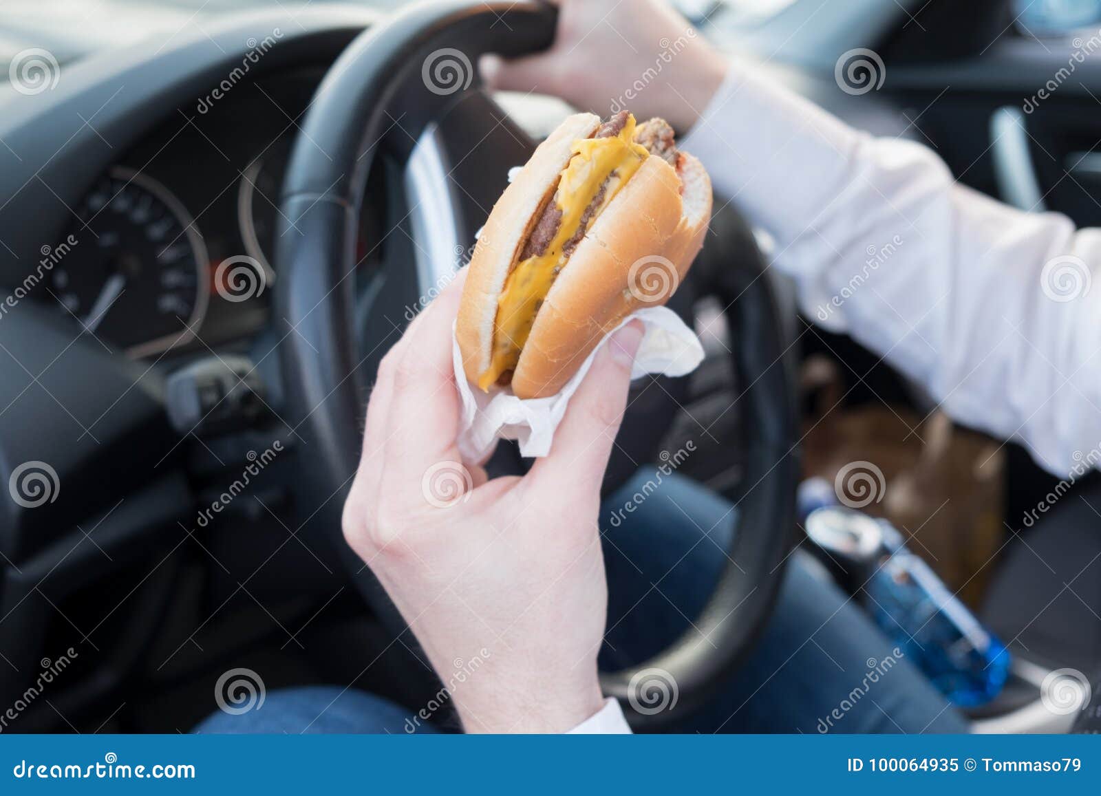 Man Eating an Hamburger while Driving Car Stock Image - Image of person ...