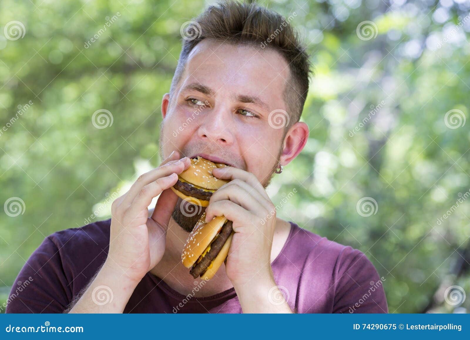 Man eating a hamburger stock image. Image of beef, body - 74290675