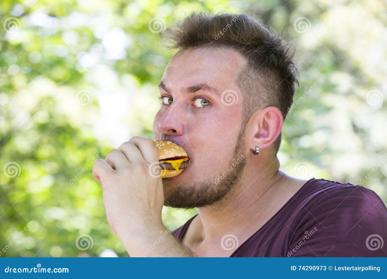 Man eating a hamburger stock image. Image of eating, fast - 74290973