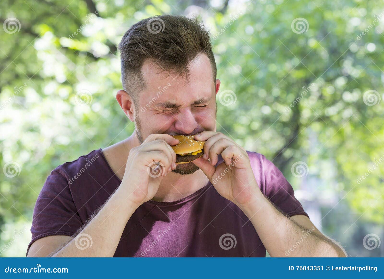Man eating a hamburger stock image. Image of beef, adult - 76043351