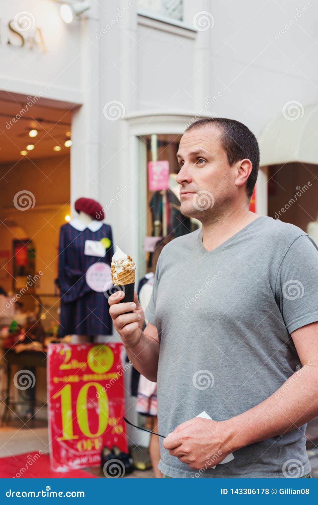 Man eating an ice cream stock photo. Image of shops - 143306178