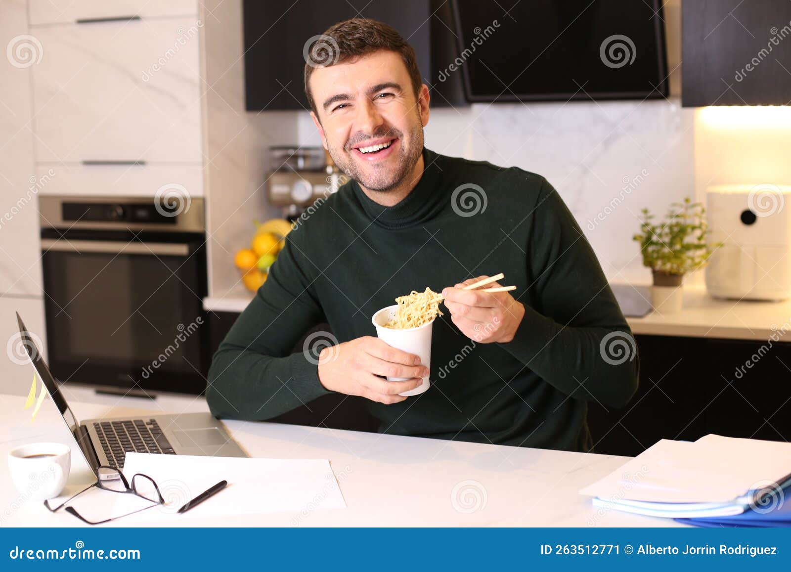Man Eating Instant Noodles while Doing Home Office Work Stock Image ...