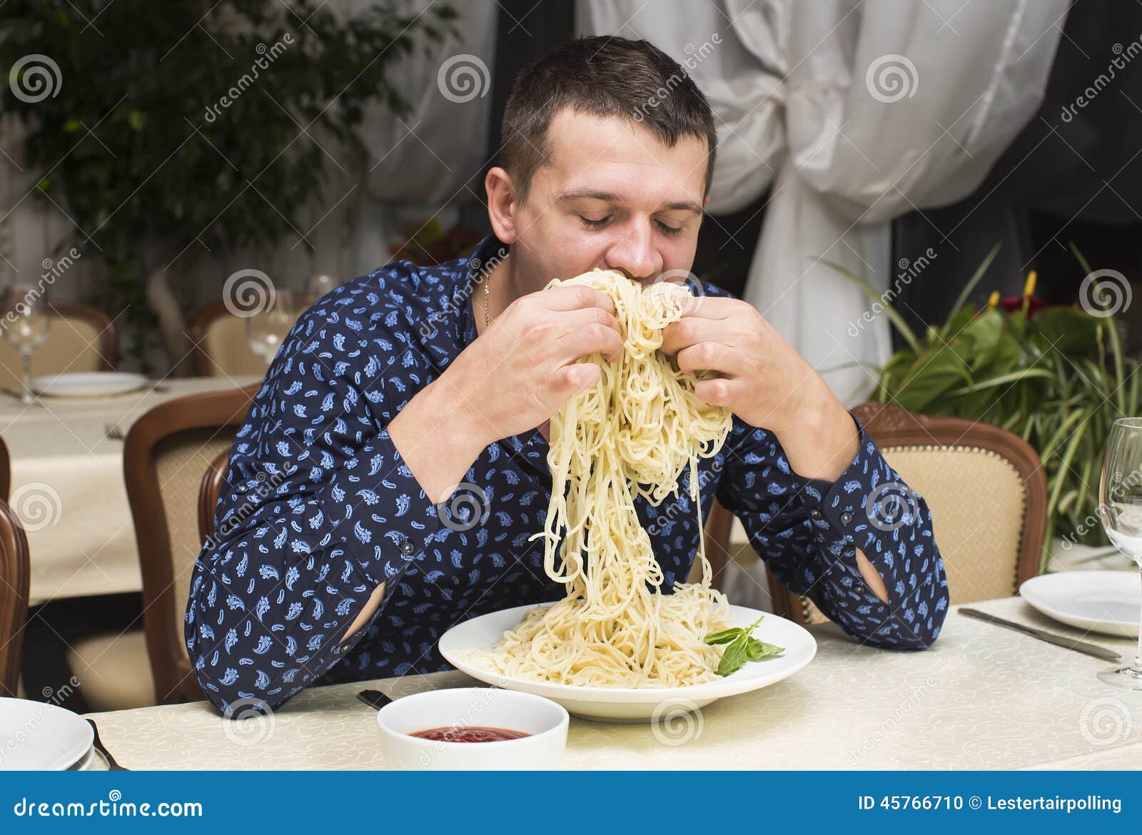 Man Eating a Large Portion of Pasta Stock Photo - Image of cutlery ...