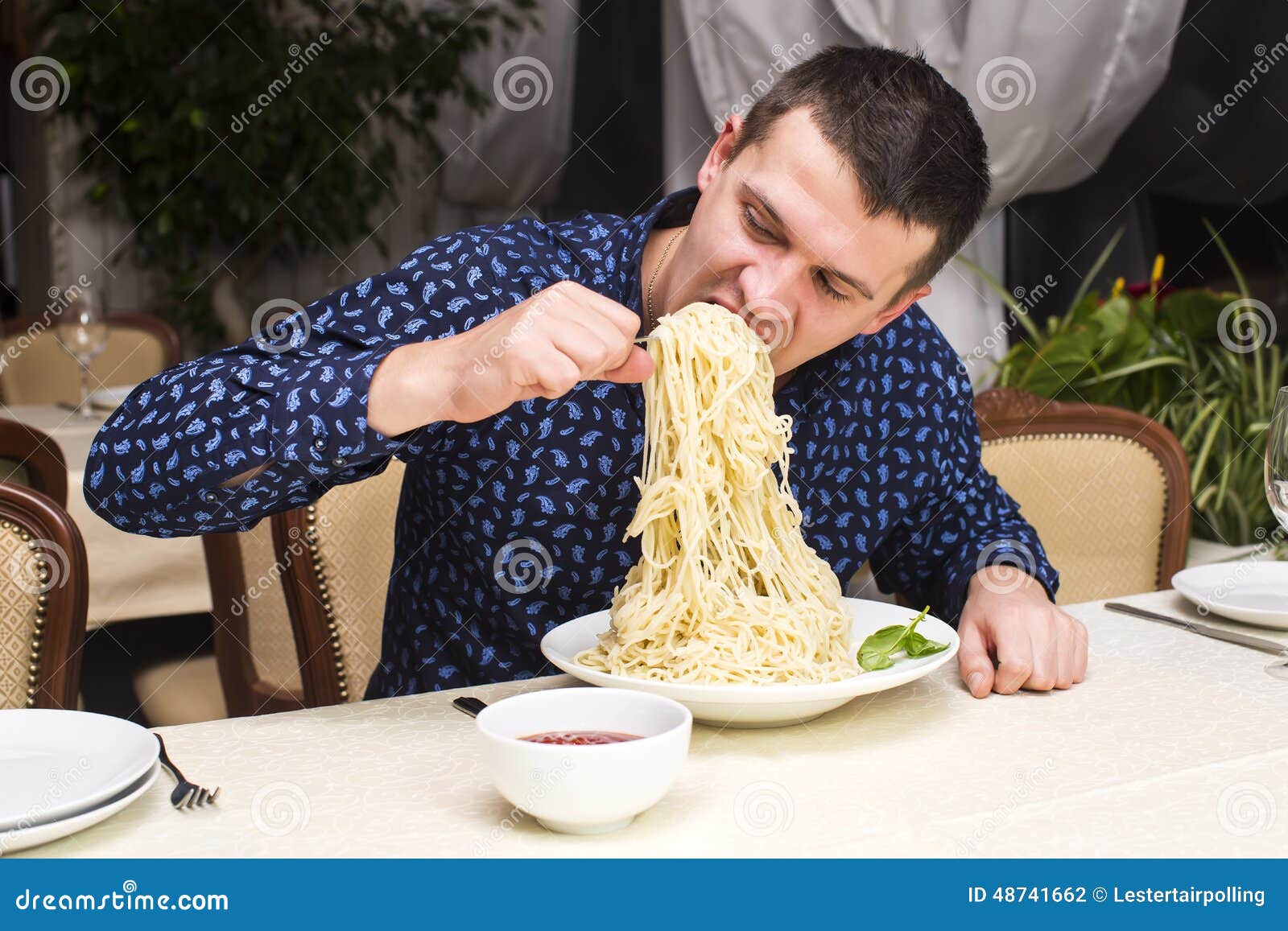 Man Eating a Large Portion of Pasta Stock Photo - Image of fish, adult ...