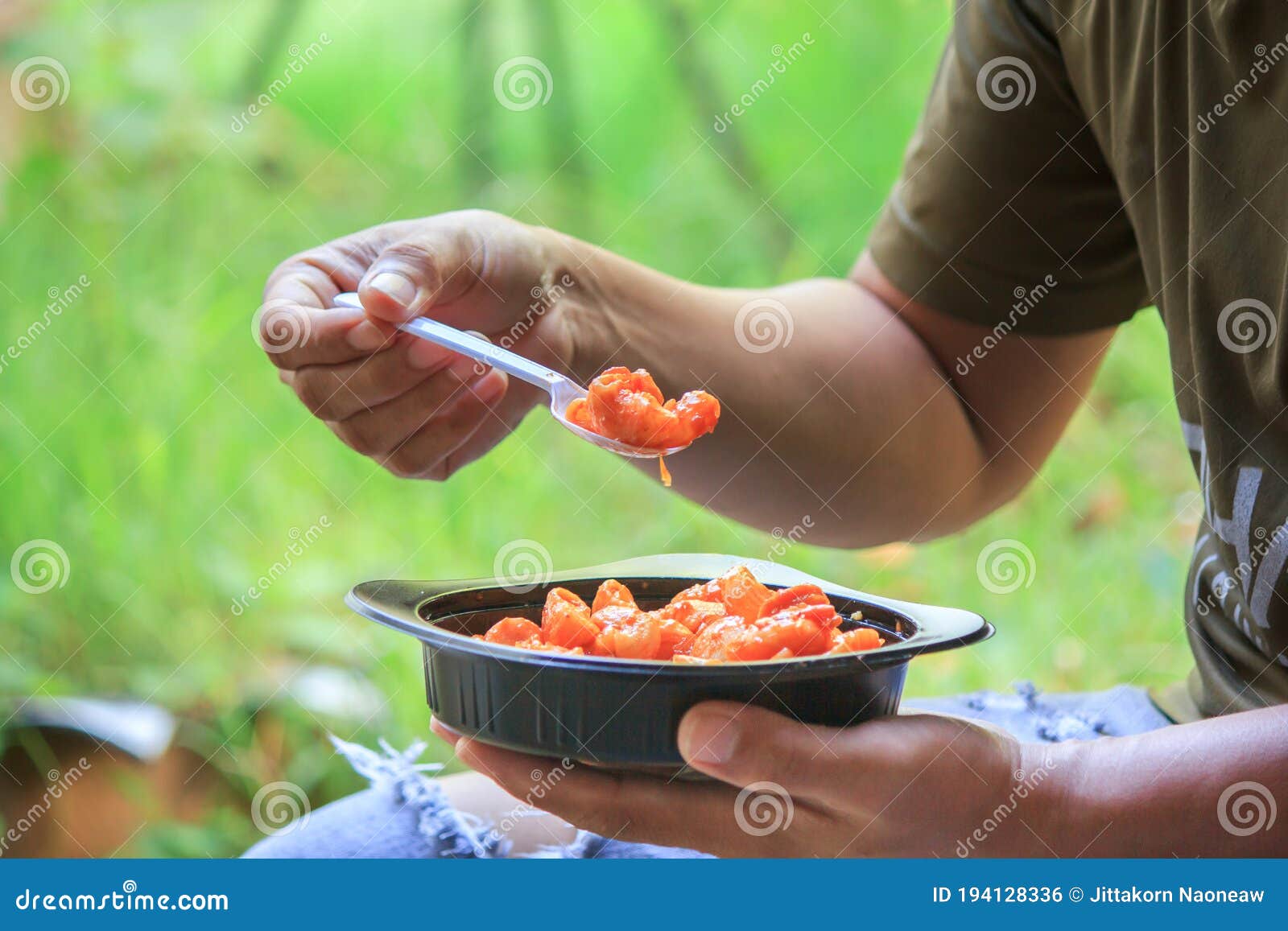 A man eating a lunch box stock photo. Image of asian - 194128336