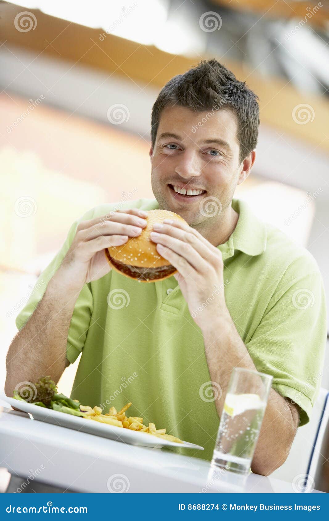 Man Eating Lunch at a Cafe stock photo. Image of colour - 8688274