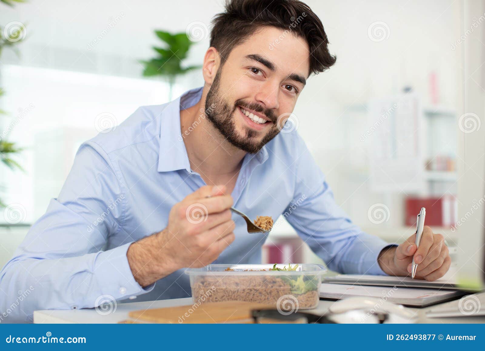 Man Eating Lunch while Working at Office Stock Image - Image of snack ...