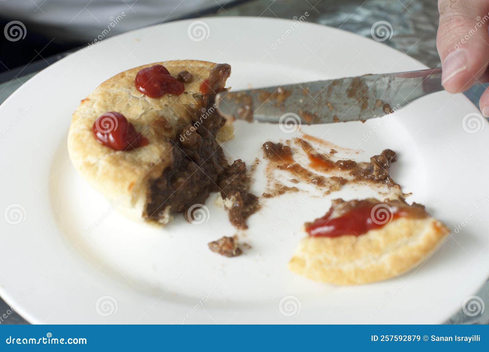 Man Eating a Meat Pie Topped with Ketchup Stock Image - Image of pastry ... Man Eating a Meat Pie Topped with Ketchup Stock Image - Image of pastry ...