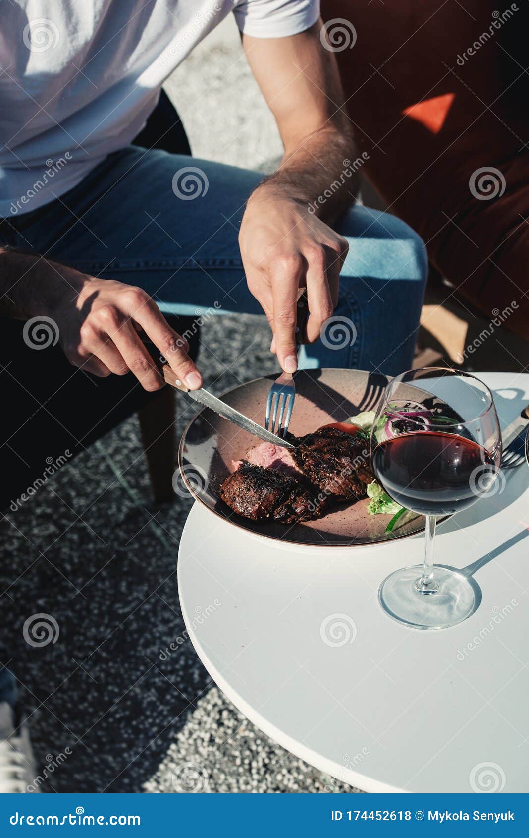 Man Eating Meat with Vegetables. Outdoors Stock Photo - Image of dish ...
