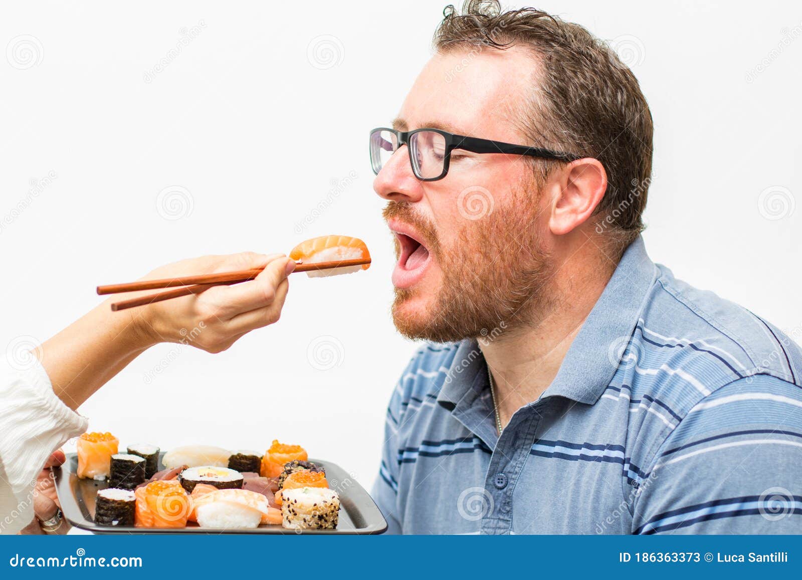 Bearded Man Eating Fish
