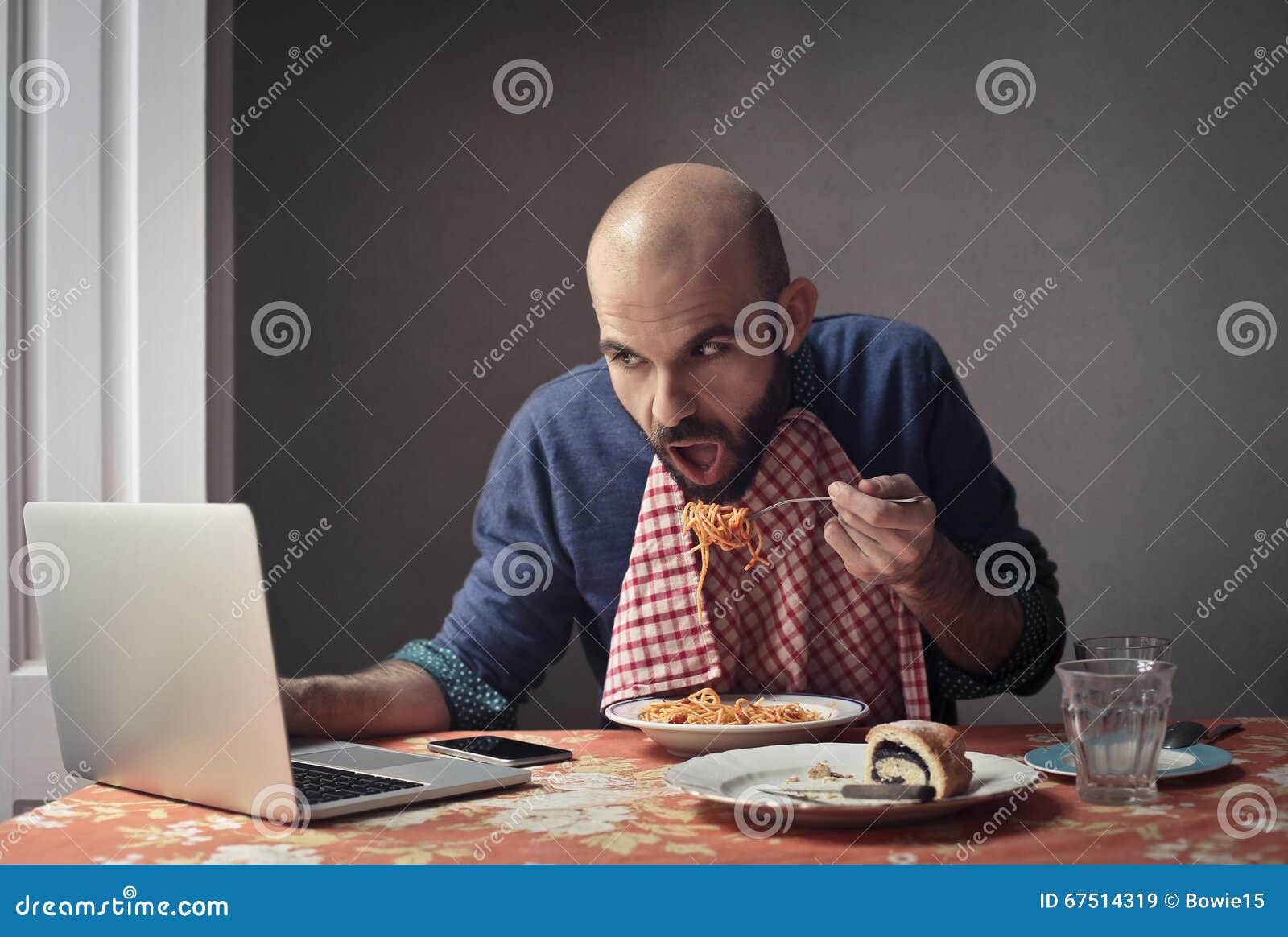 Man Eating Pasta and Checking Computer Stock Image - Image of adult ...