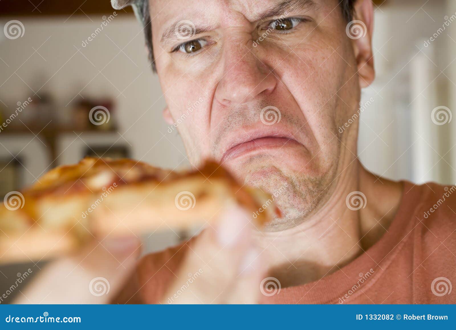 Man Eating Pepperoni Pizza stock photo. Image of munching - 1332082