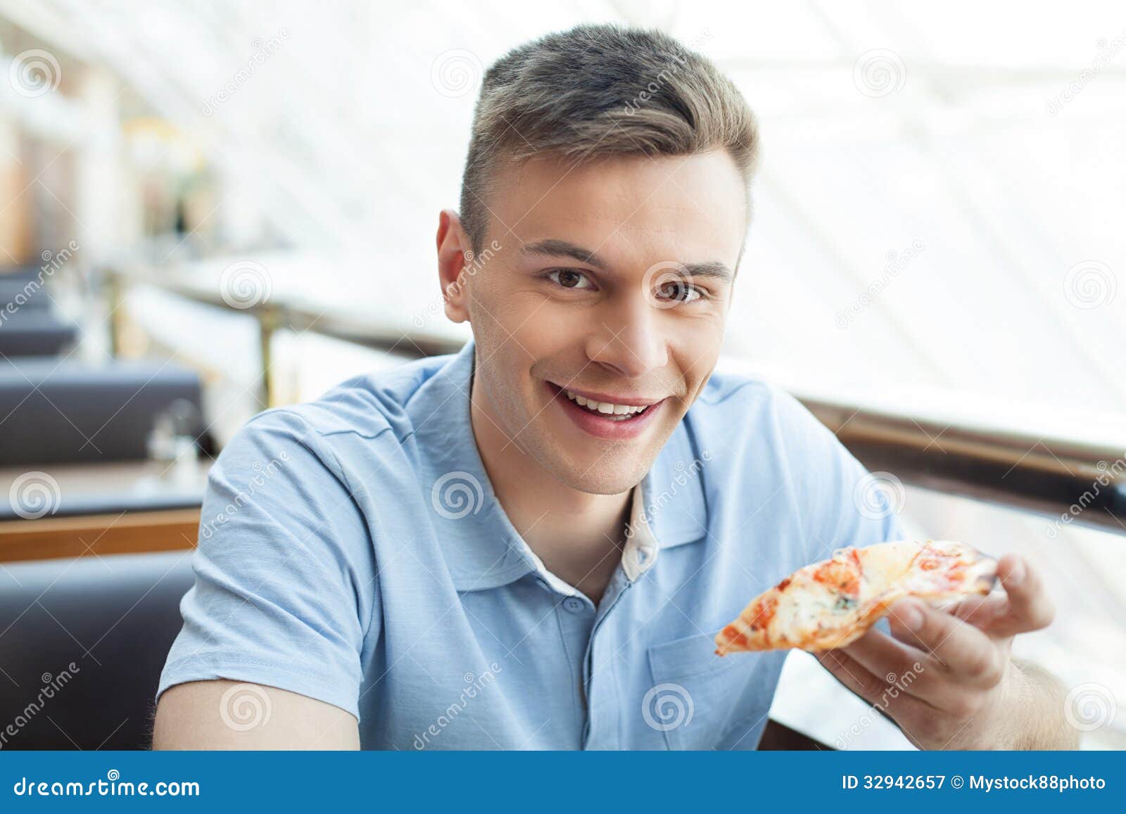 Man eating pizza. stock image. Image of indoors, relaxing - 32942657