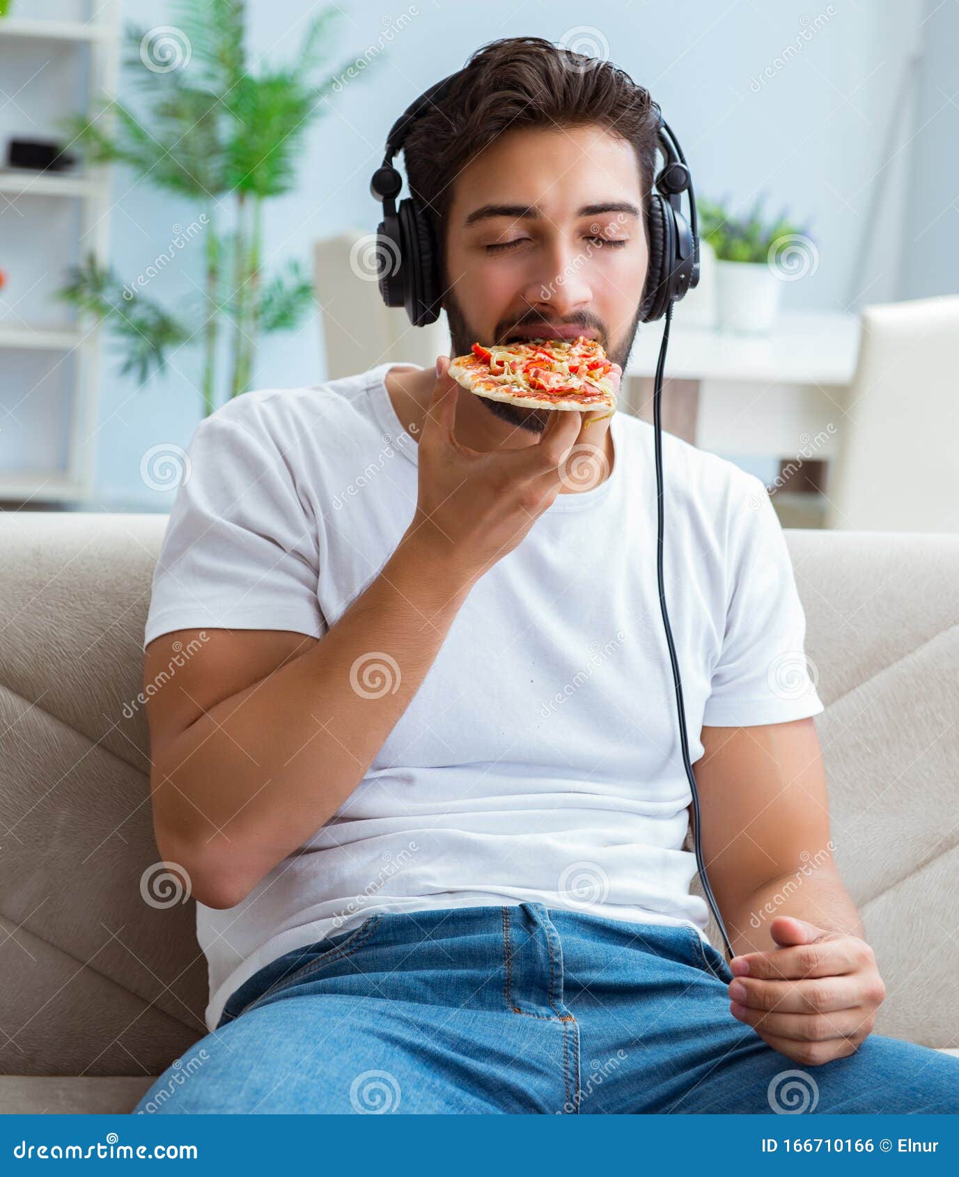 Man Eating Pizza Having a Takeaway at Home Relaxing Resting Stock Photo ...