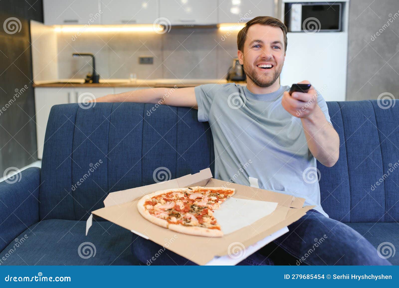 Man Eating Pizza Having a Takeaway at Home Relaxing Resting Stock Photo ...