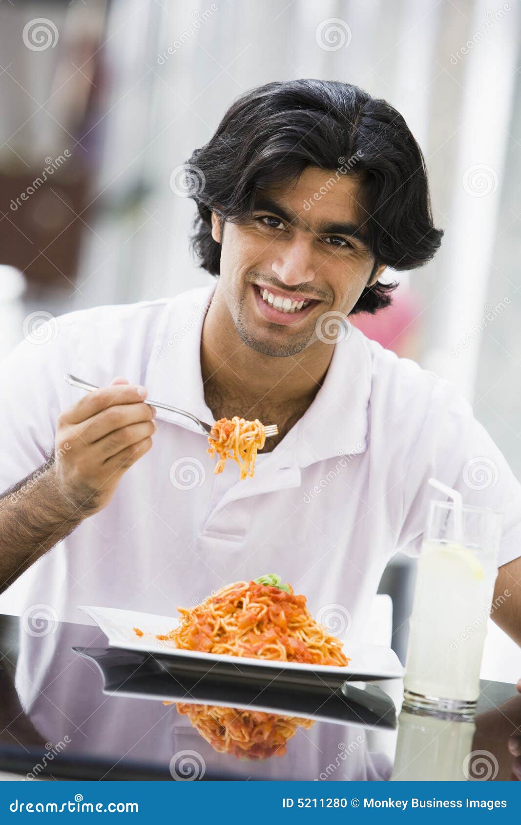 Man Eating Plate of Pasta at Cafe Stock Photo - Image of delicious ...
