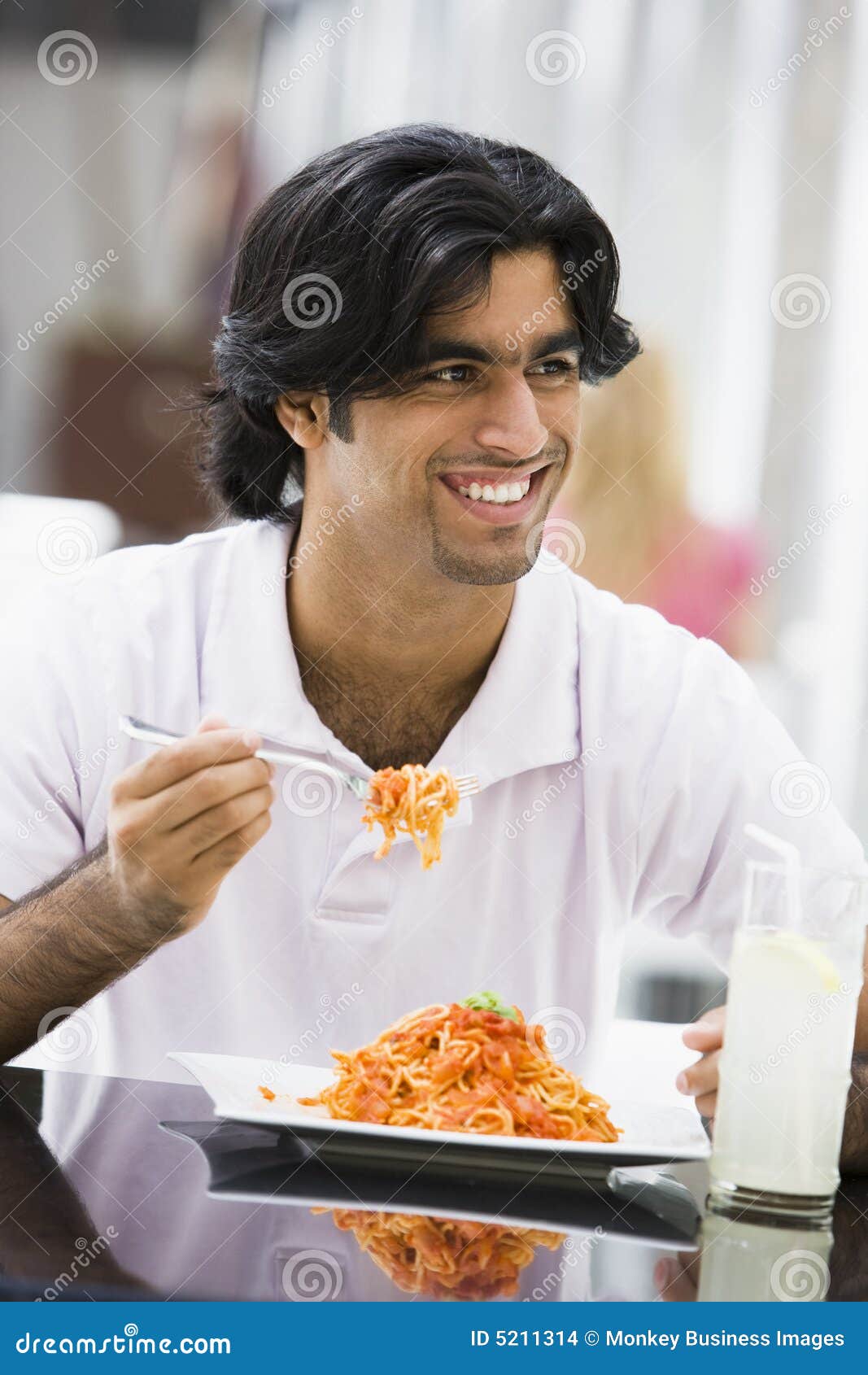 Man Eating Plate of Pasta at Cafe Stock Photo - Image of restaurant ...