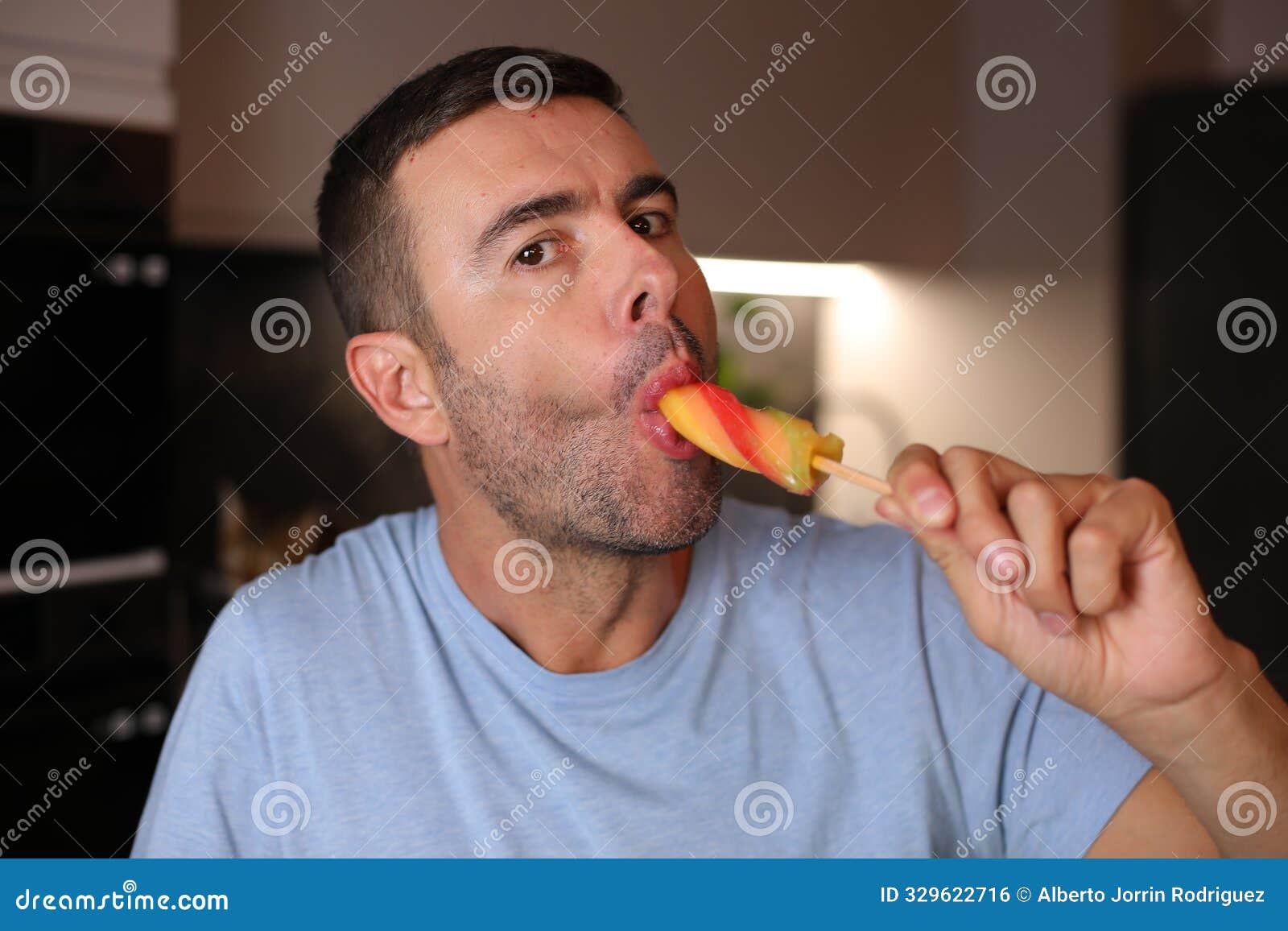Man Eating a Popsicle with Anxiety Stock Photo - Image of cream, tasty ...