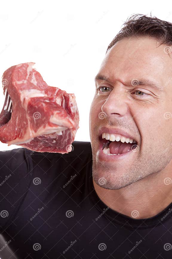 Man eating raw steak stock image. Image of sirloin, steak - 16011739