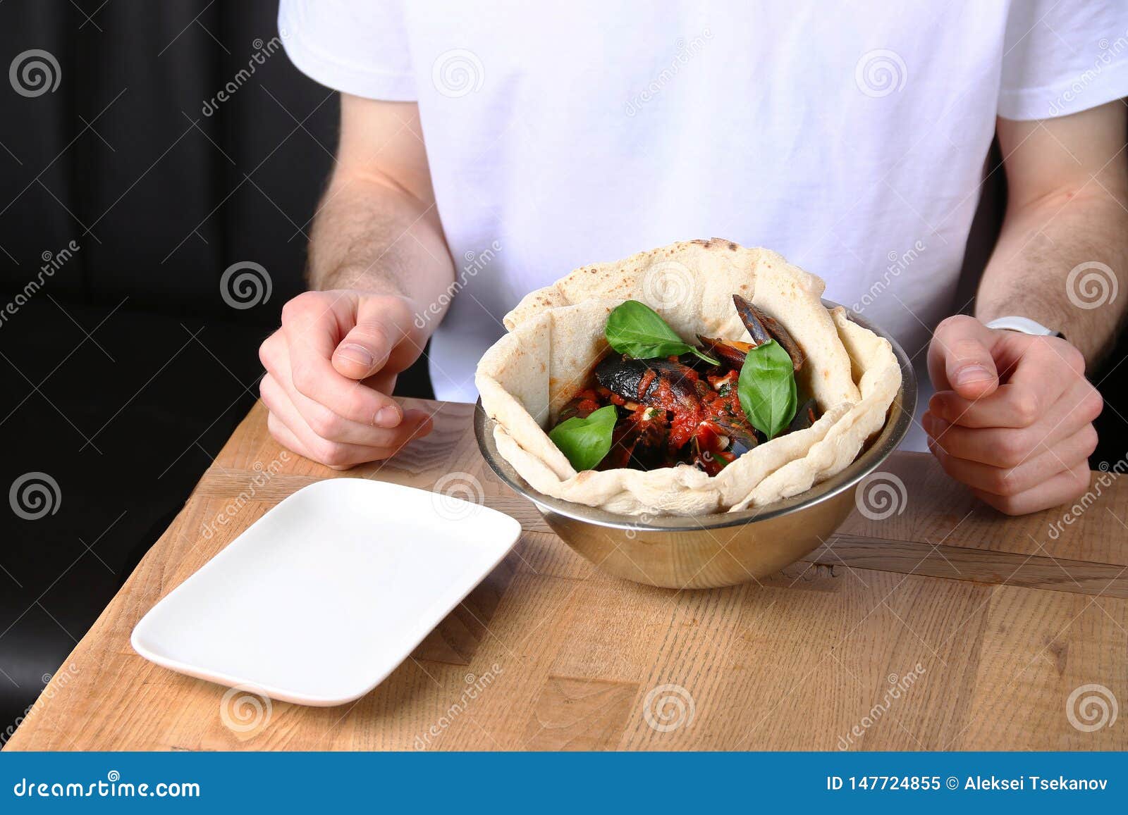 Man Eating in Restaurant and Dishes on Table Stock Image - Image of ...