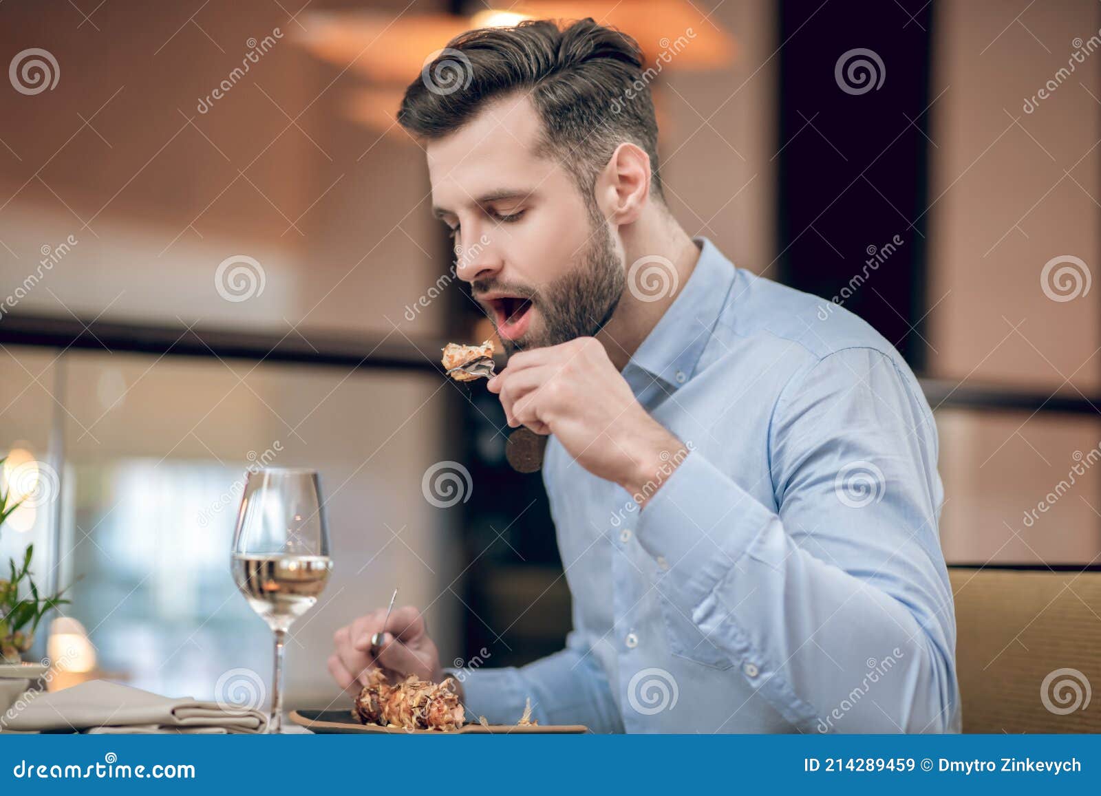 Man Eating Seafood at the Restaurant and Looking Involved Stock Image ...