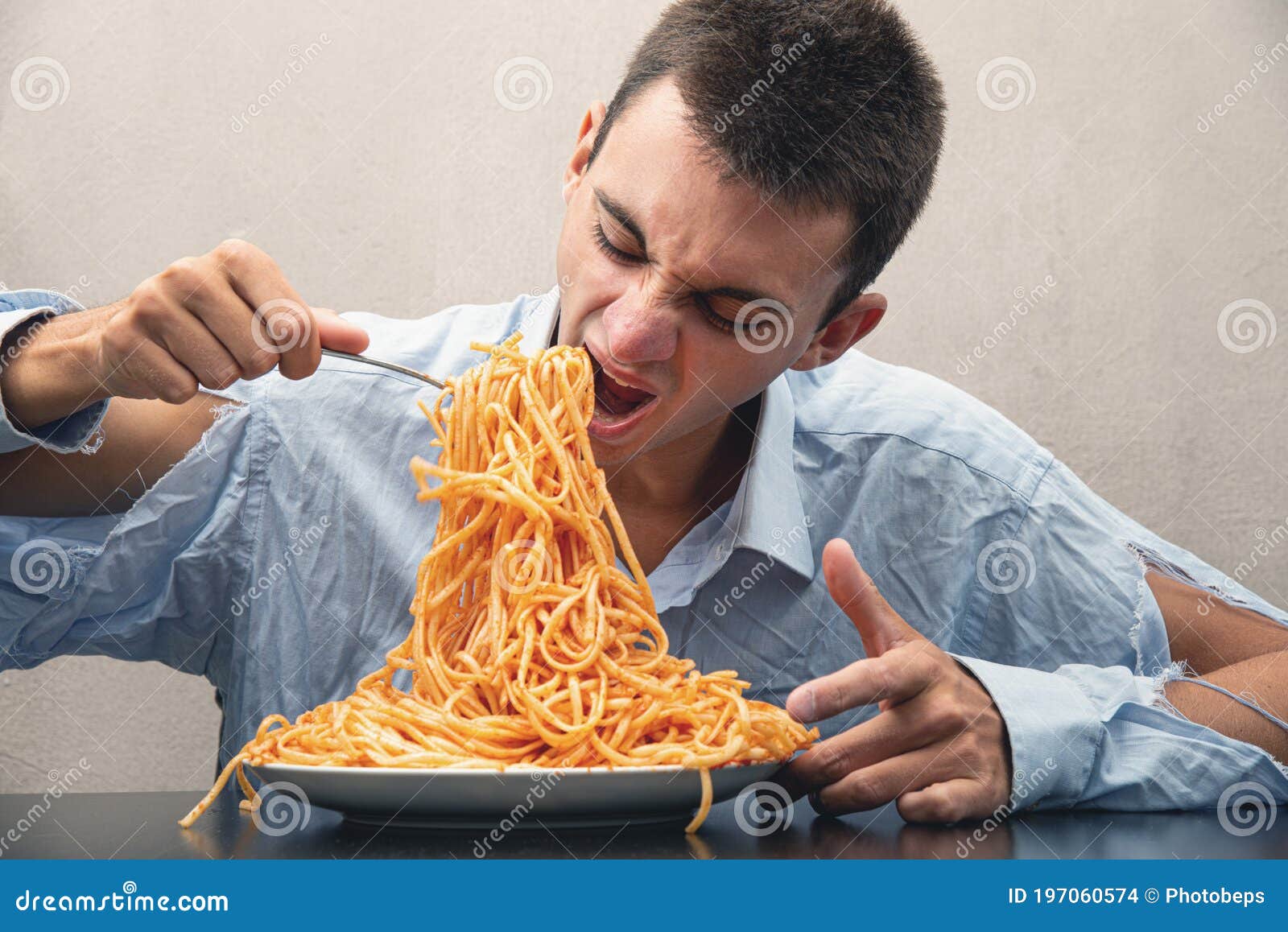 Man Eating Spaghetti with Tomato Sauce Stock Photo - Image of food ...