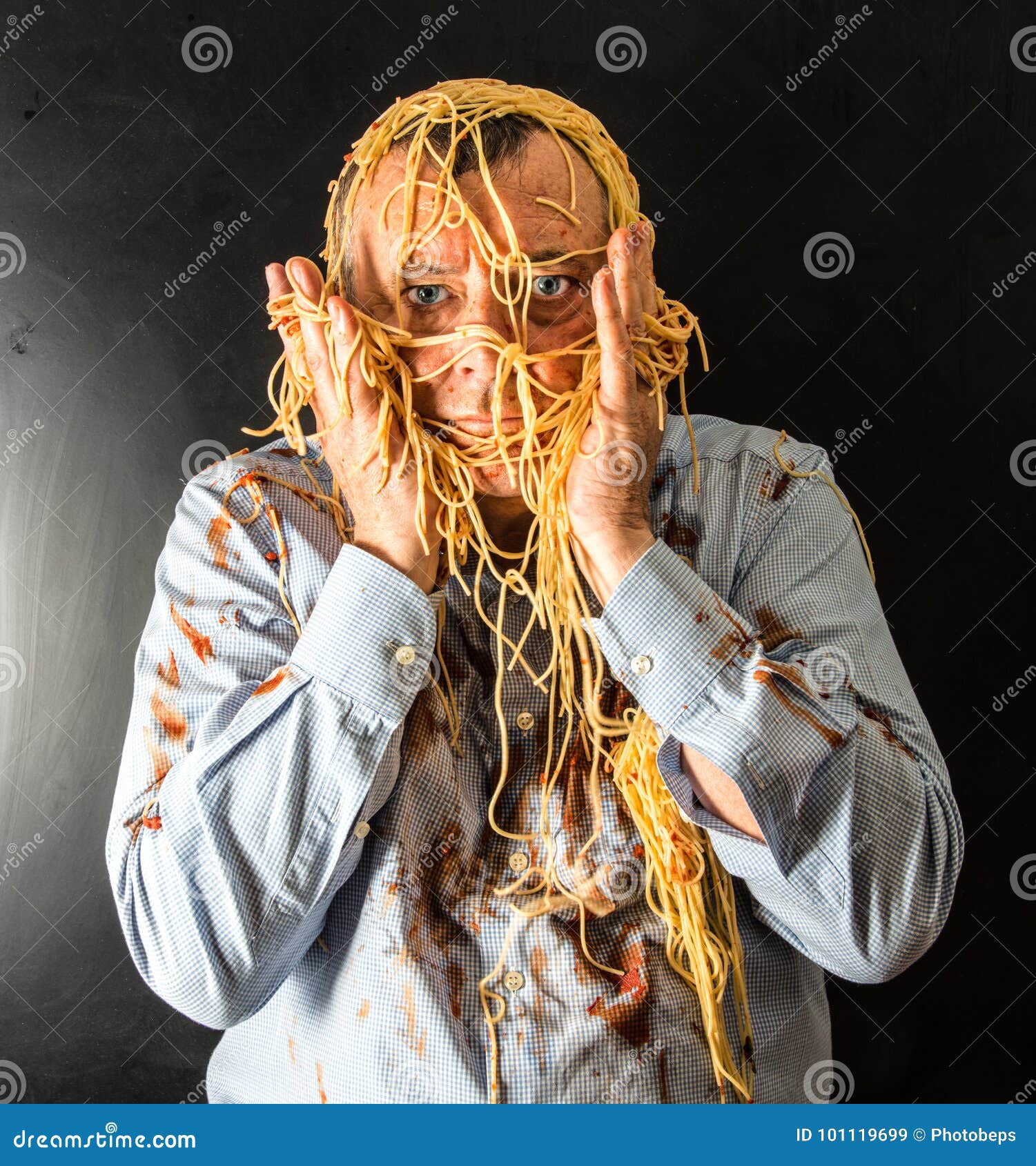 Man Eating Spaghetti with Tomato Sauce in Head Stock Image - Image of ...