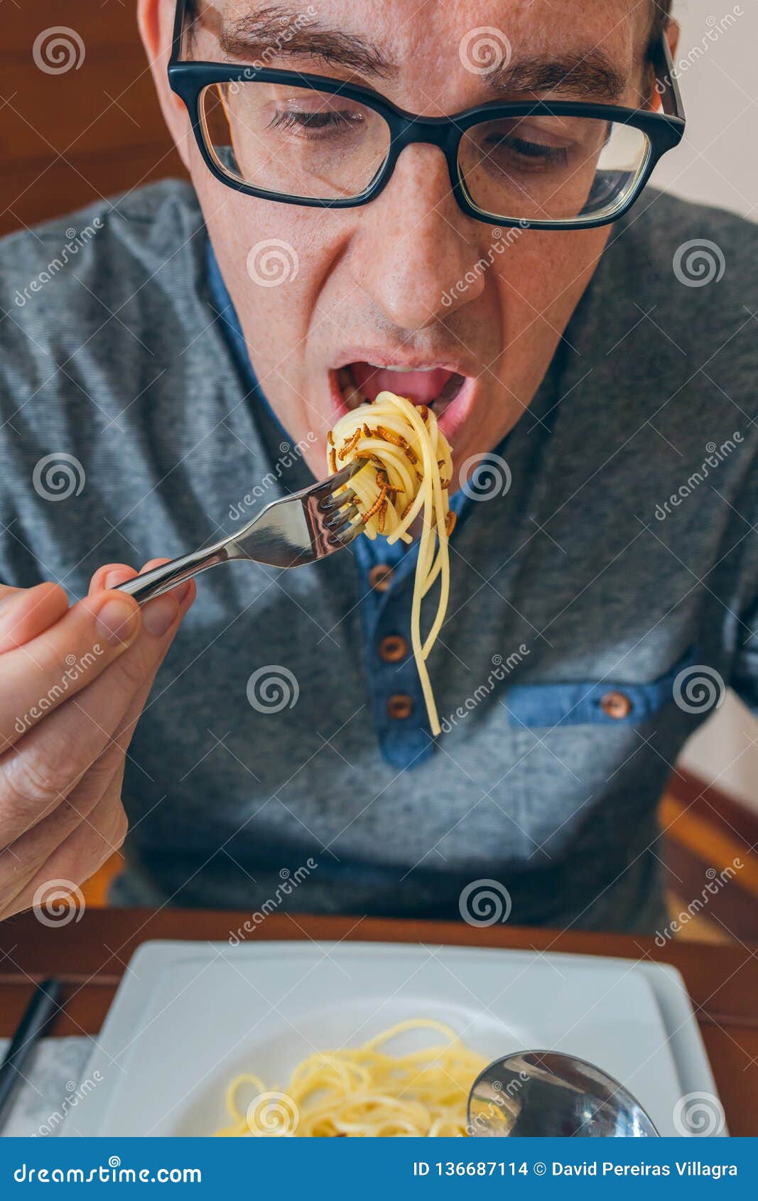 Man Eating Spaghetti with Worms Stock Photo - Image of lunch ...