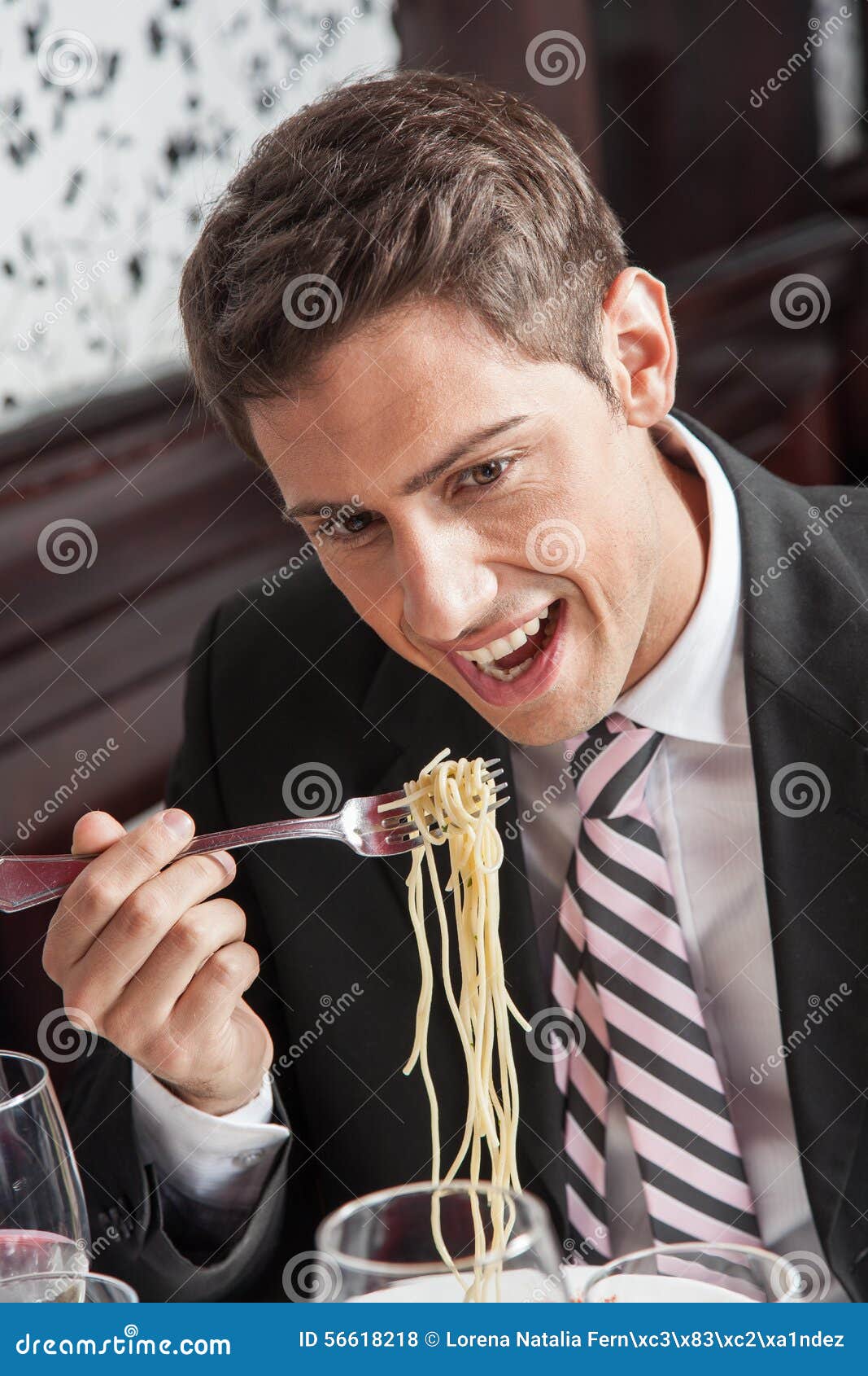 Man eating spaghetti stock photo. Image of hotel, drink - 56618218