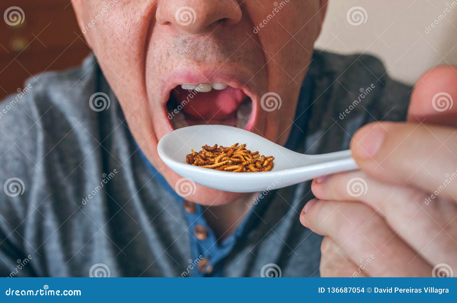 Man Eating a Spoonful of Worms Stock Photo - Image of face, closeup ...