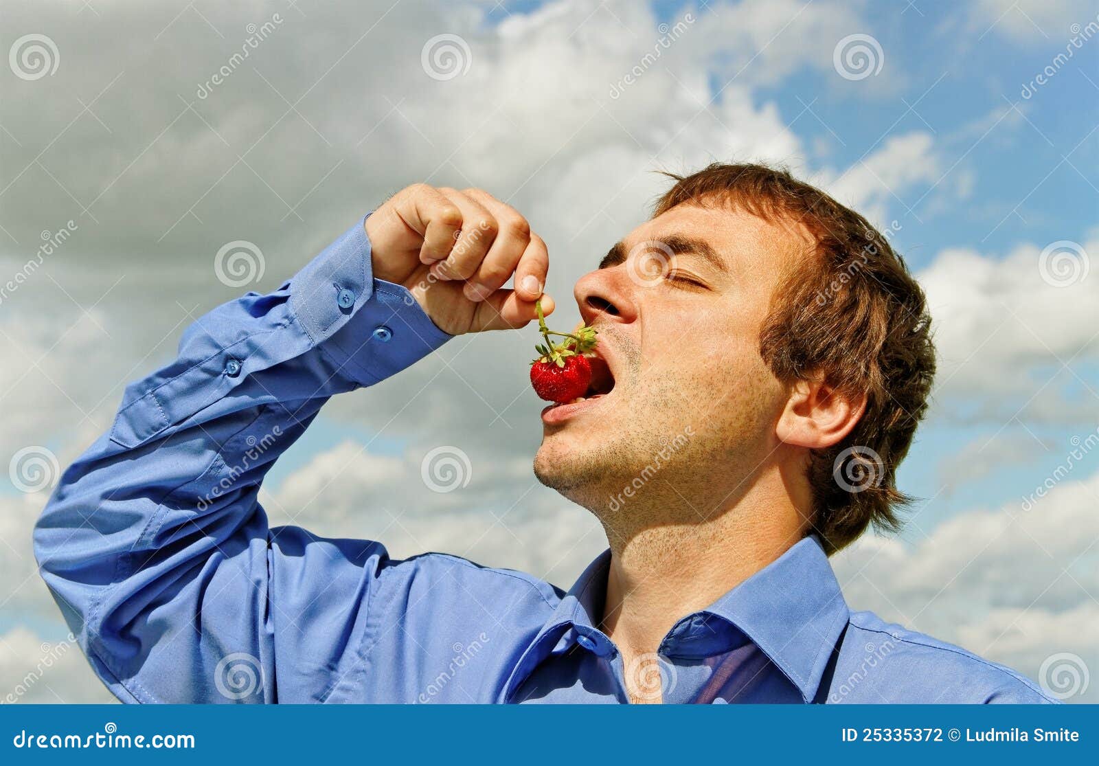 Man eating strawberry. stock photo. Image of open, healthy - 25335372
