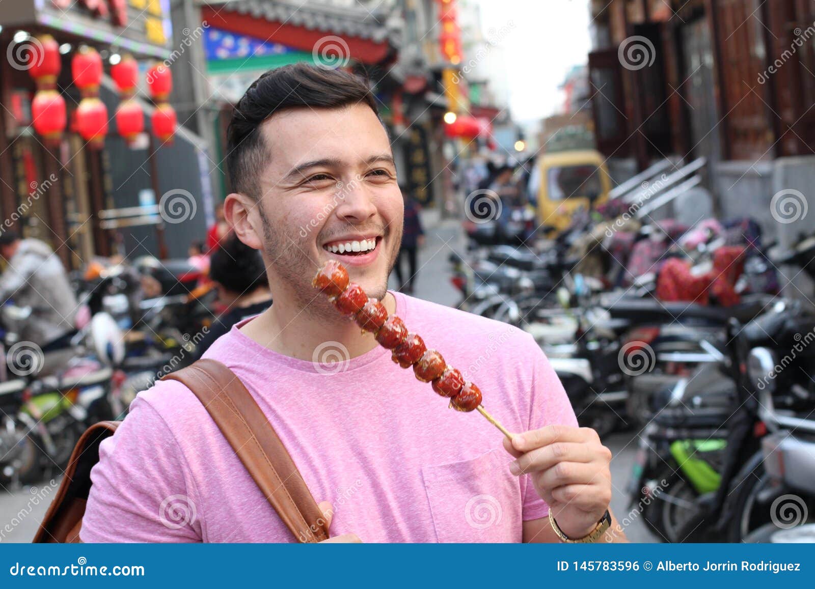 Man Eating Sugar-coated Haws on a Stick in China Stock Photo - Image of ... Man Eating Sugar-coated Haws on a Stick in China Stock Photo - Image of ...