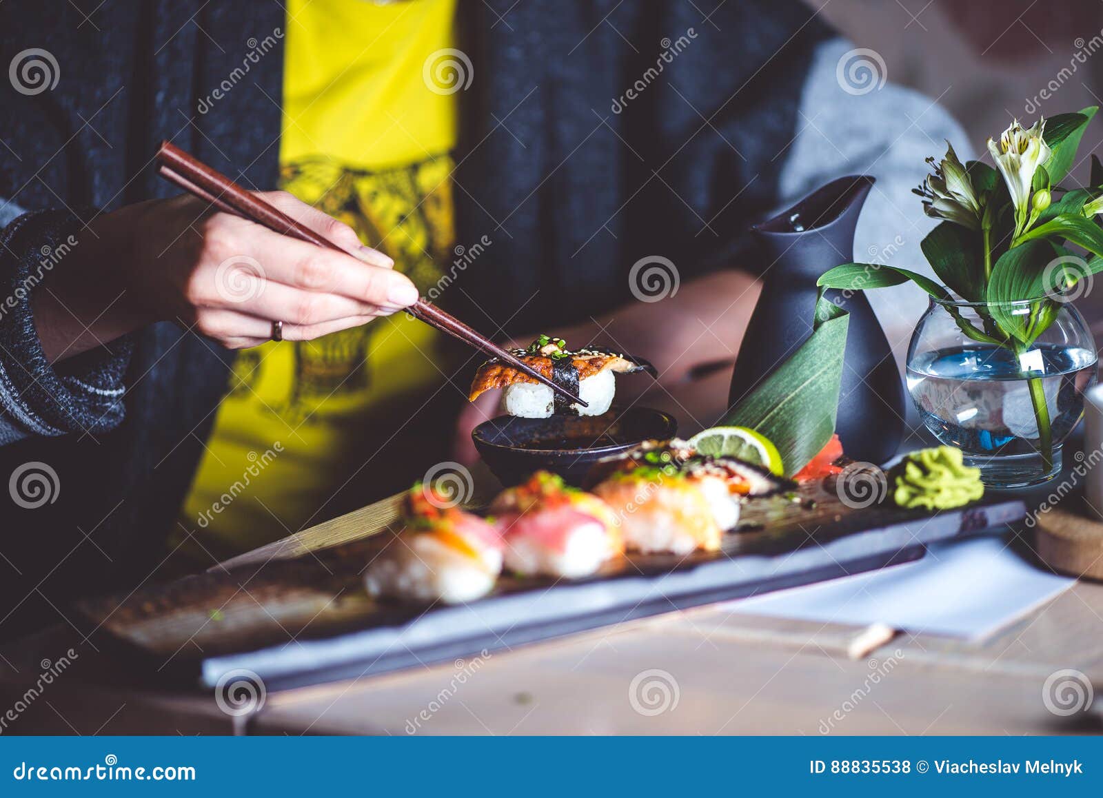 Man eating sushi stock photo. Image of restaurant, rice - 88835538
