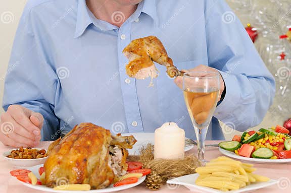 Man eating turkey stock image. Image of cheerful, room - 6632719