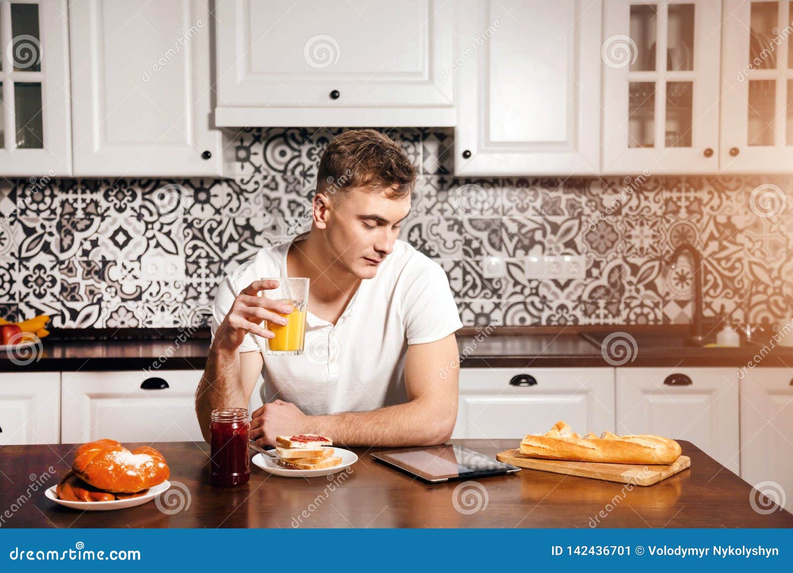 Man Eating and Using Tablet Stock Image - Image of dish, butter: 142436701