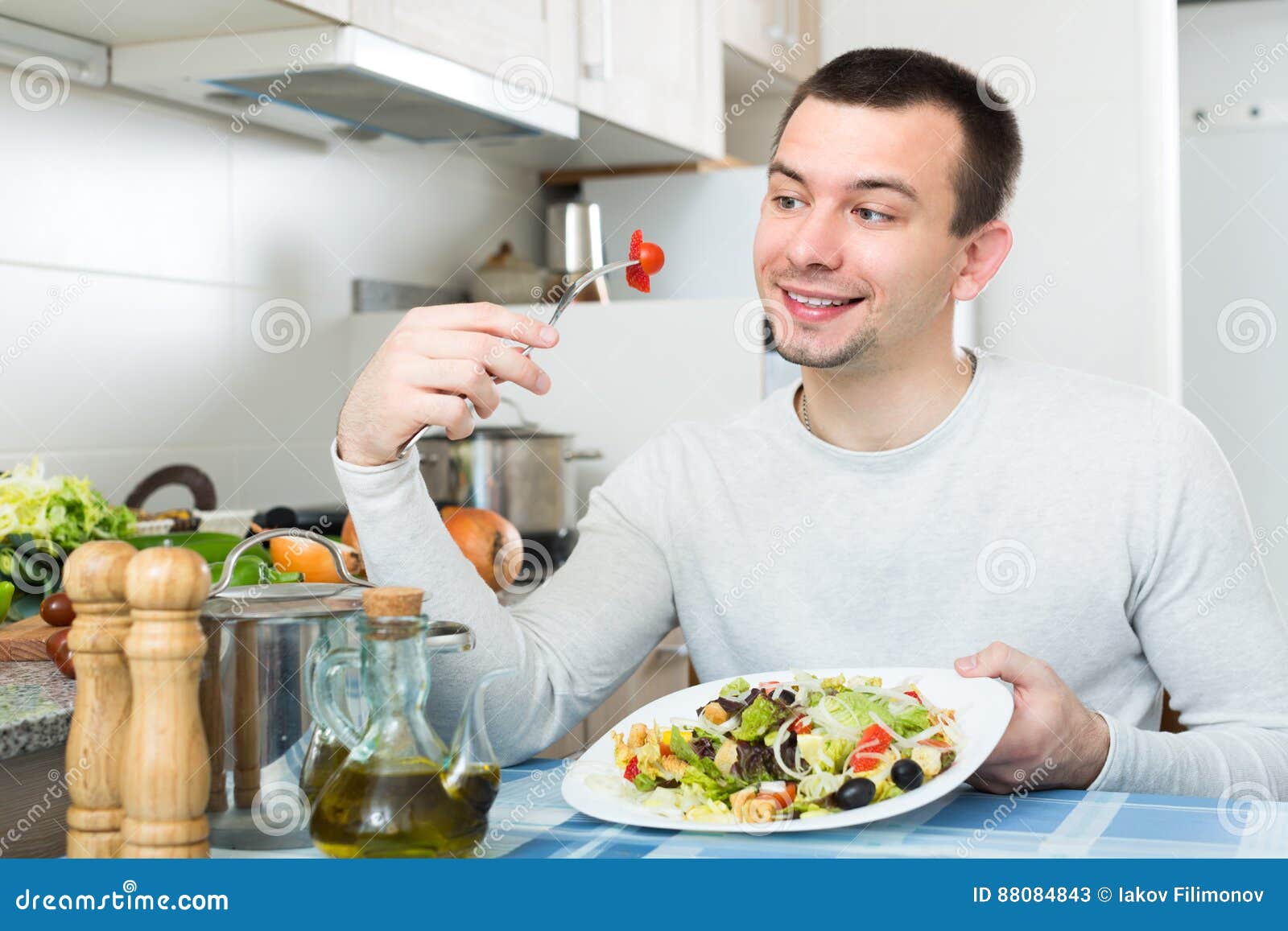 Man Eating Vegetable Salad in Kitchen Stock Image - Image of meal ...