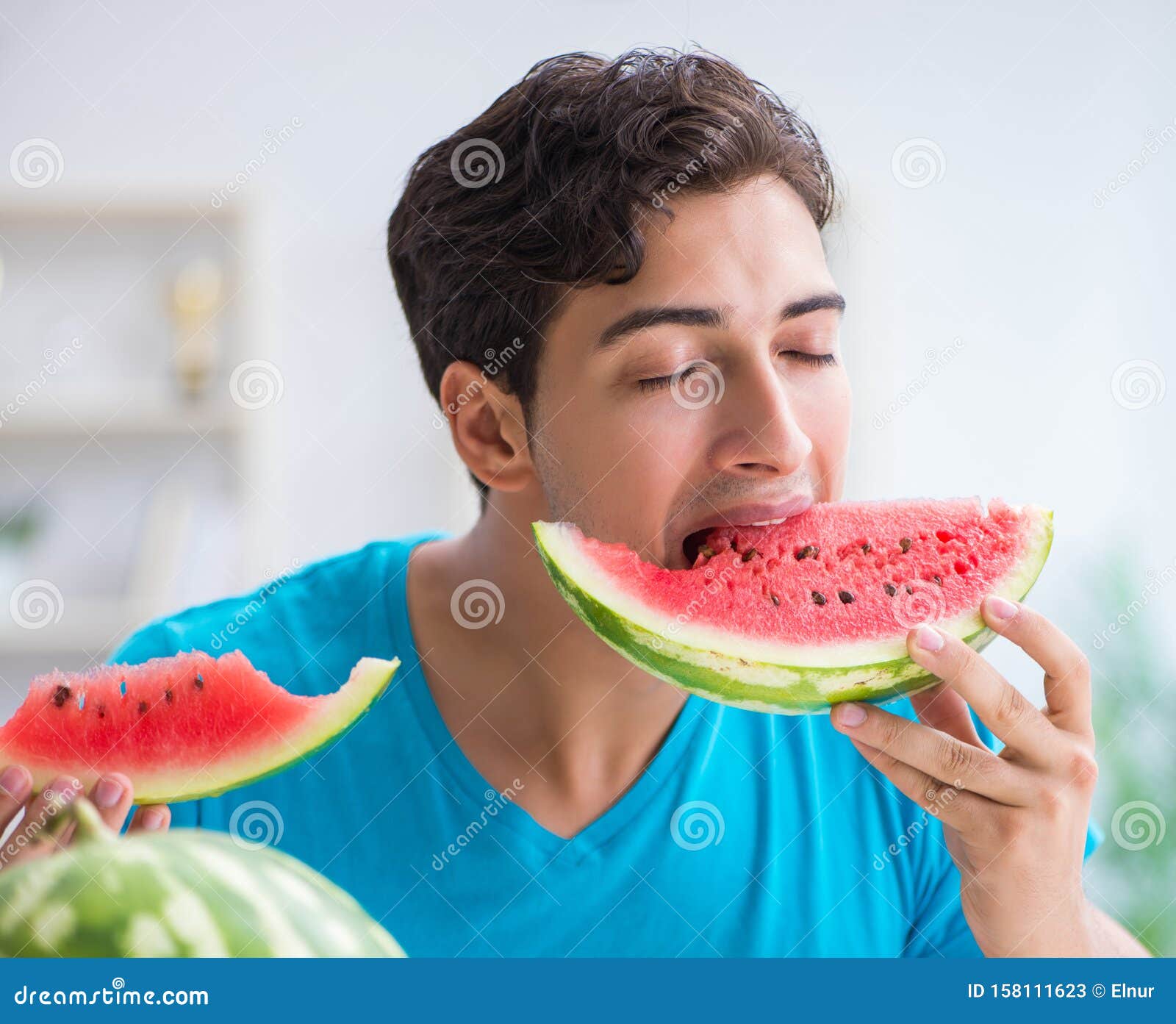 Man Eating Watermelon at Home Stock Image - Image of eating, happiness ...