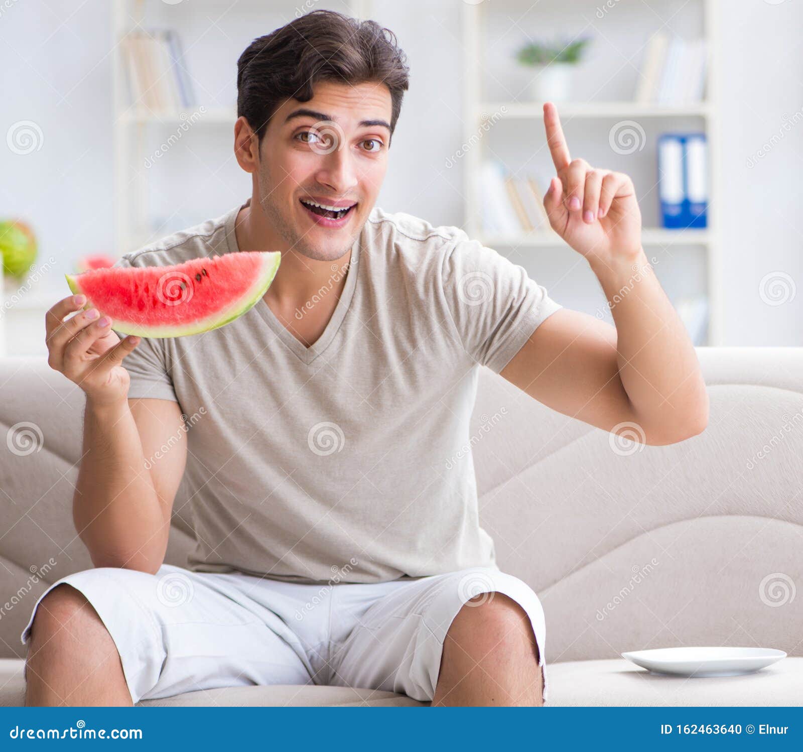 Man Eating Watermelon at Home Stock Photo - Image of handsome, excited ...